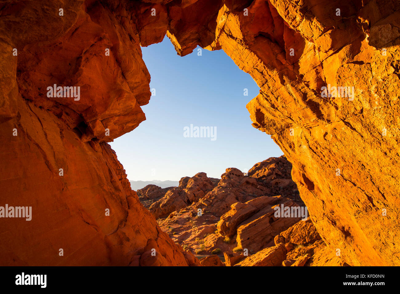 Redrock sandstone arch at sunrise in the Valley of fire state park ...