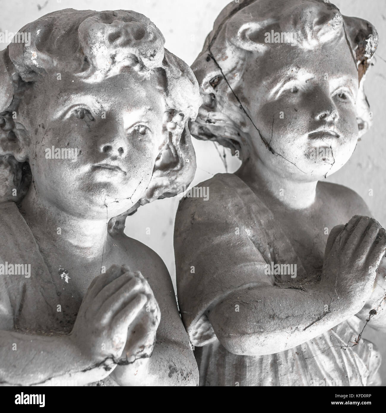 Statues of children in prayer covered with cobwebs Stock Photo - Alamy