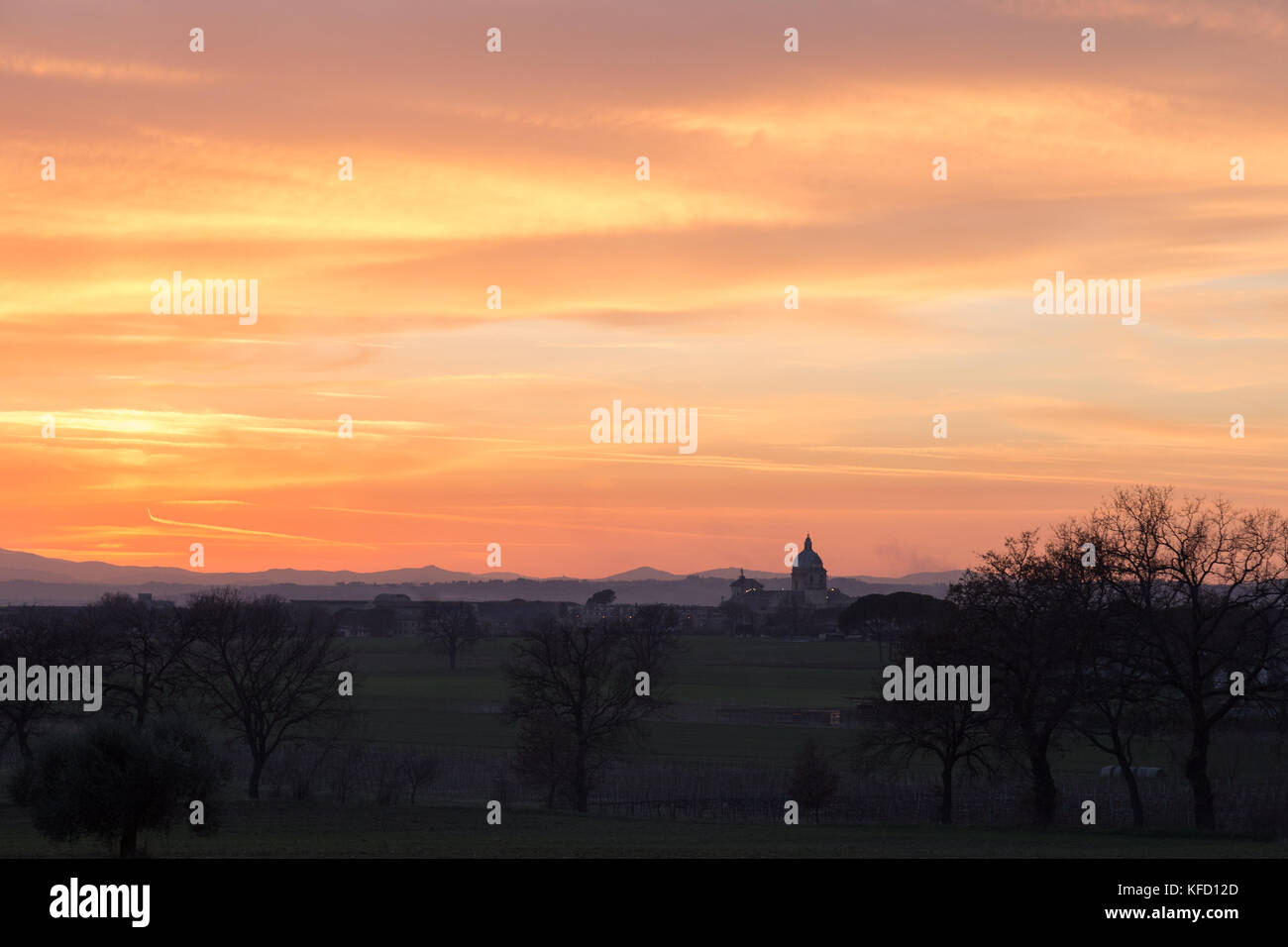 Beautiful sunset in Assisi, with Santa Maria degli Angeli church in the ...