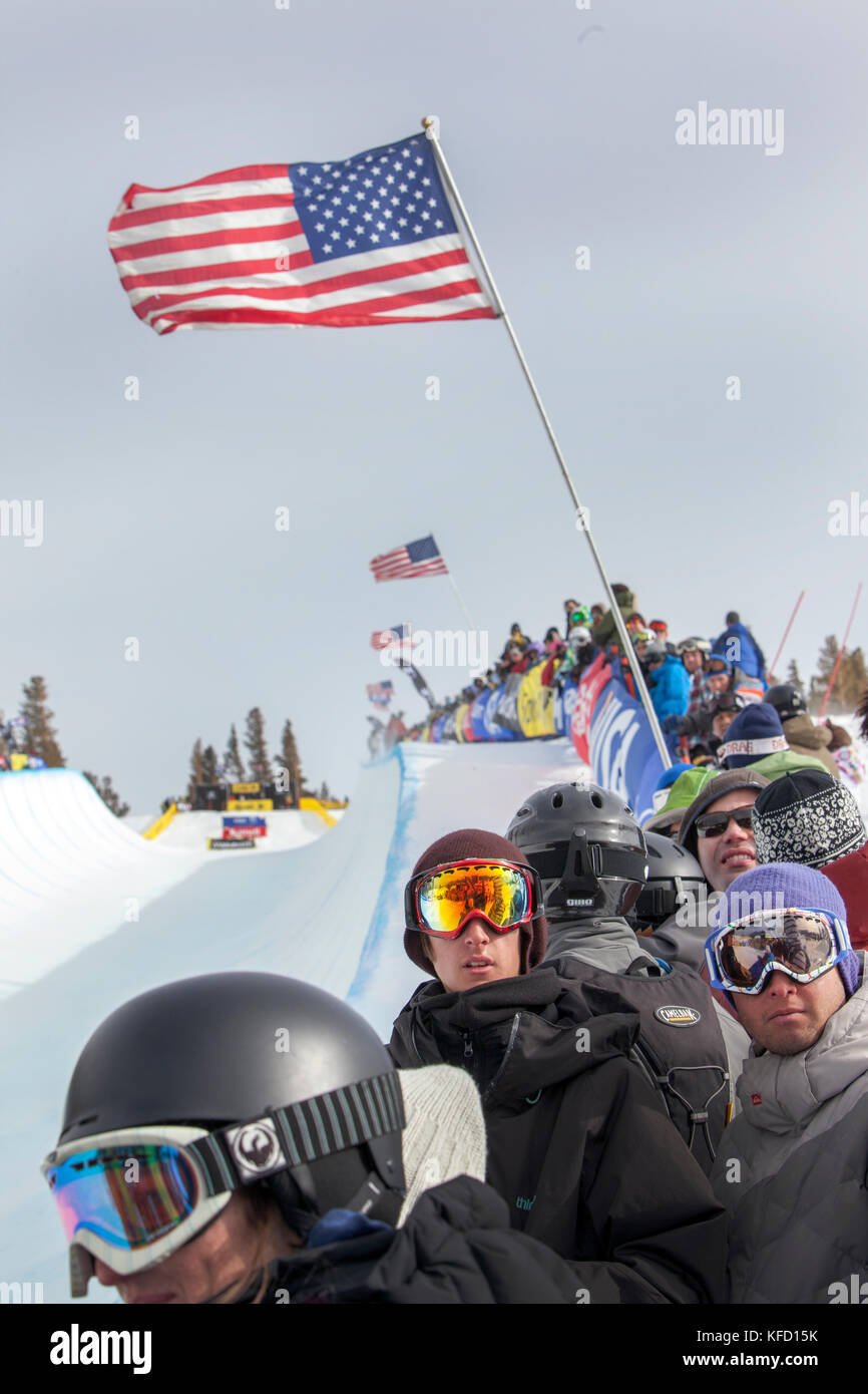 USA, California, Mammoth, crowd members watch as skiers and snoboarders ...