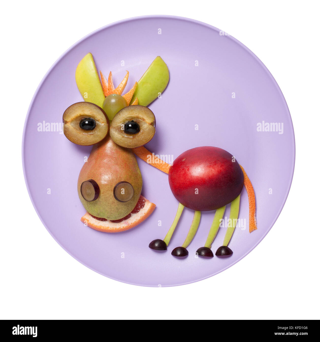 Funny fruit donkey compiled on purple plate Stock Photo - Alamy