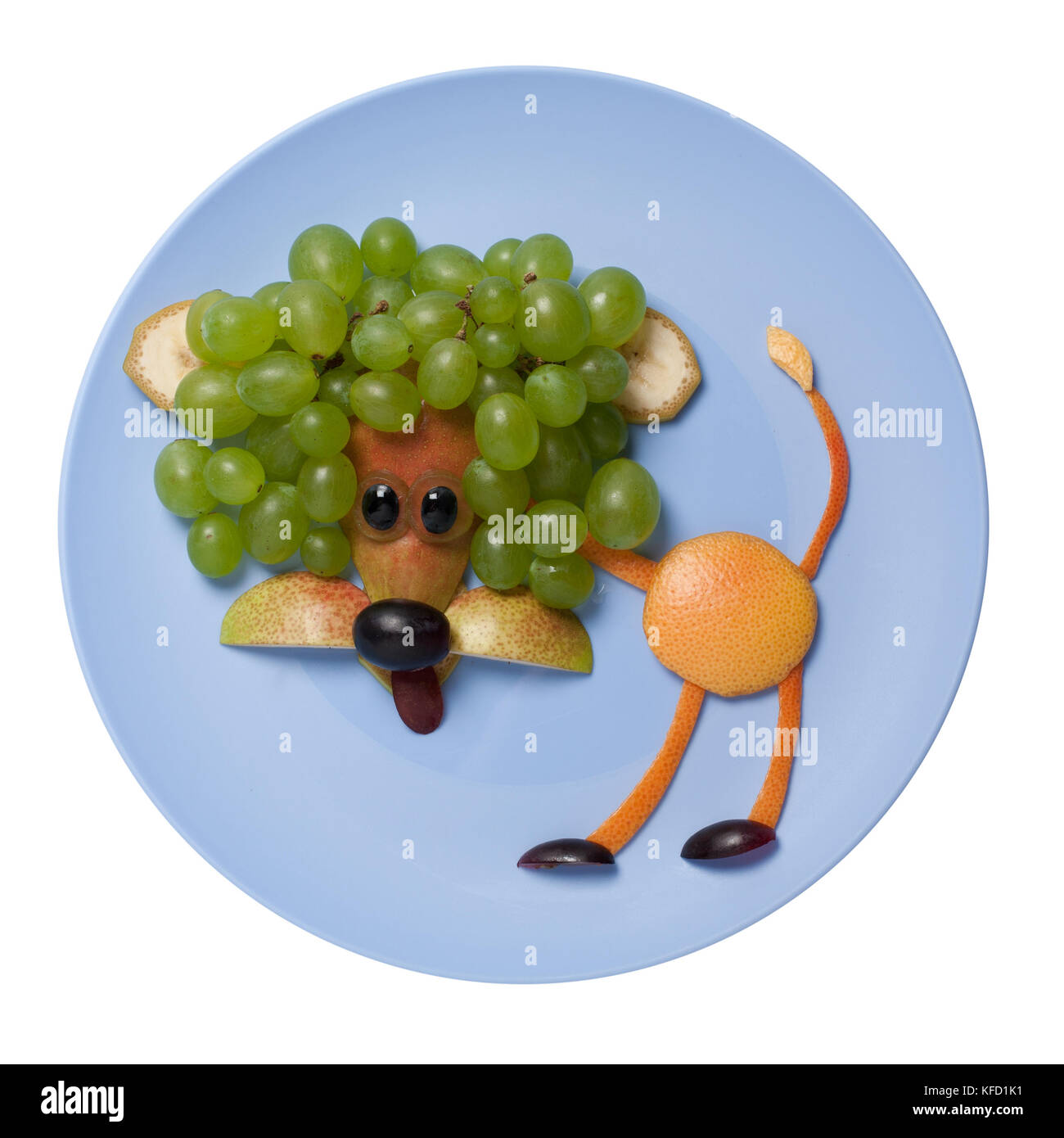 Funny fruit lion made on blue plate Stock Photo - Alamy