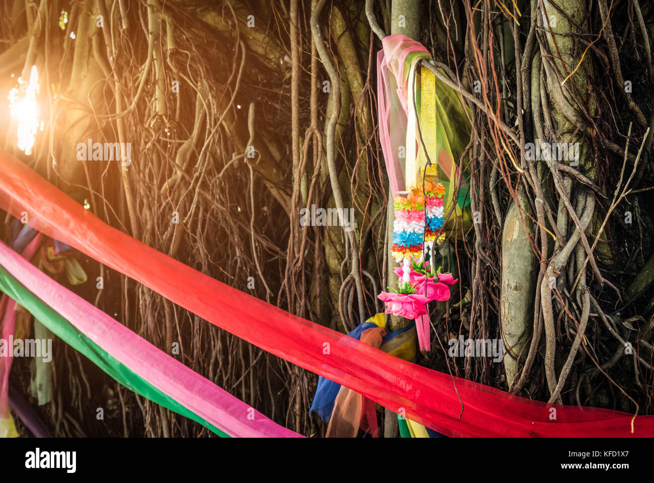 Five colors fabric wrap around the tree and garland on respiratory root ...