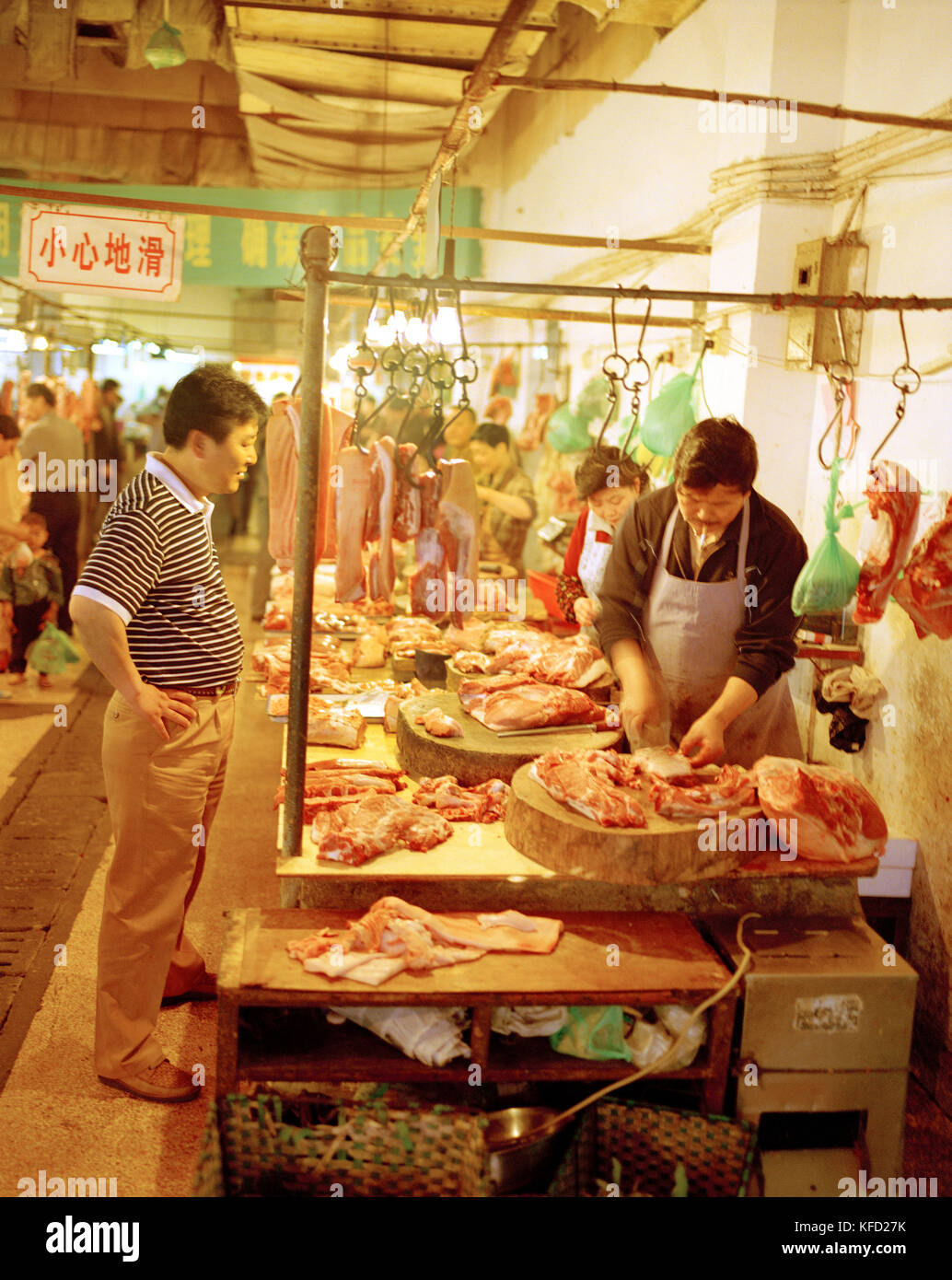 CHINA, Hangzhou, customer and butchers at meat shop Stock Photo - Alamy