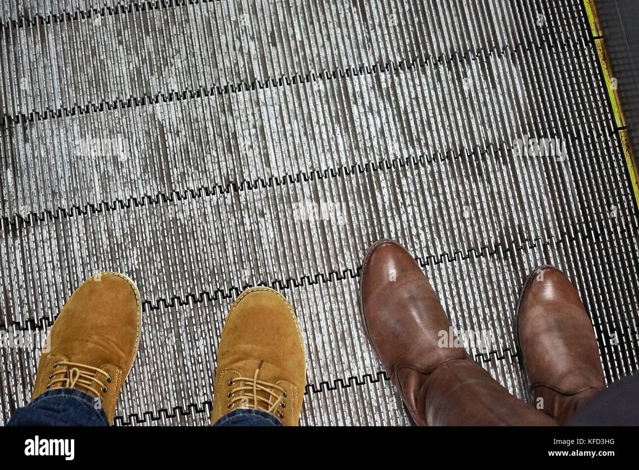 Shoes on escalator hi-res stock photography and images - Alamy