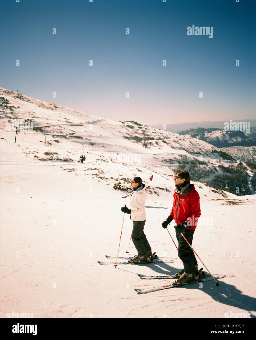 ARGENTINA, Bariloche, Cerro Cathedral, couple people skiing on snow ...