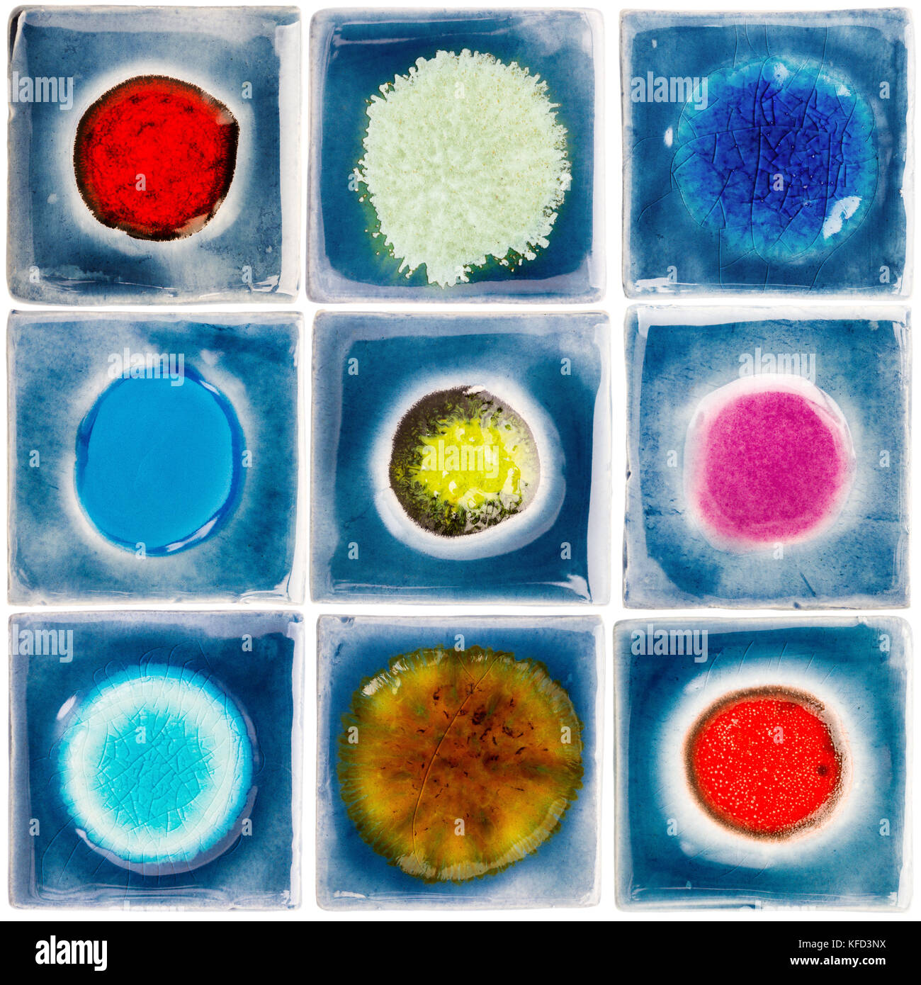 Collection of blue handmade glazed ceramic tiles with other color dots ...
