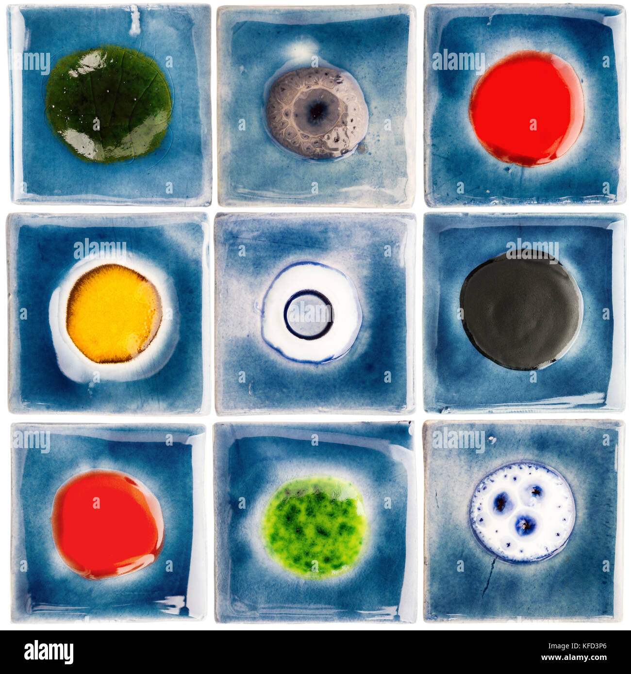Collection of blue handmade glazed ceramic tiles with other color dots ...