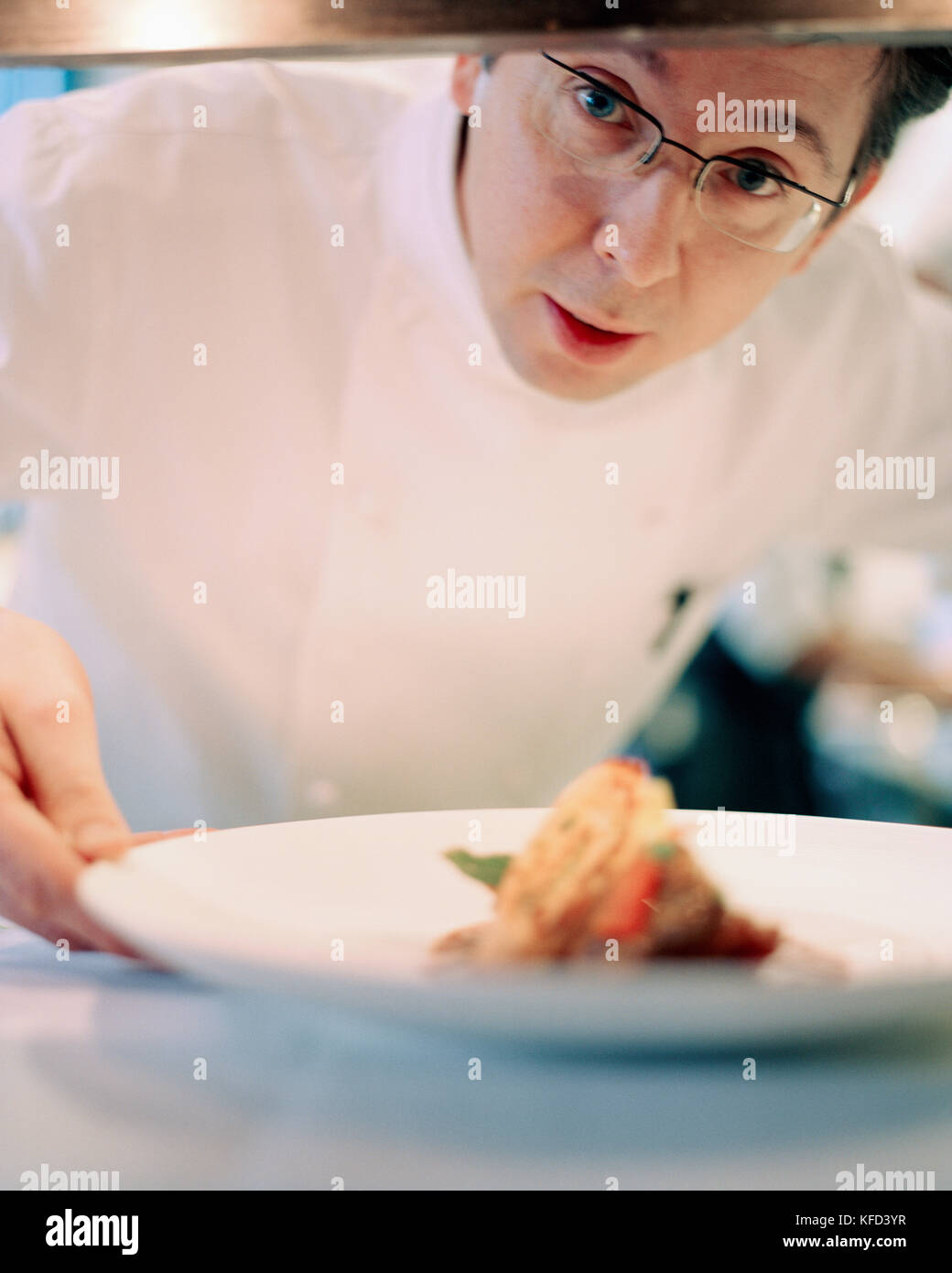 AUSTRIA, Vienna, Chef Heinz Reitbauer holding a dish at Restaurant ...