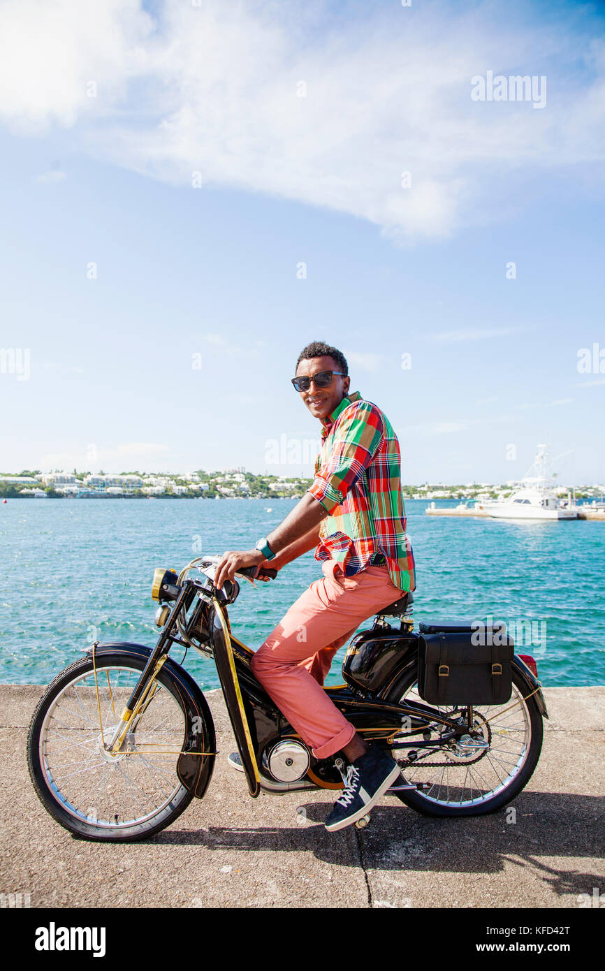 BERMUDA, Hamilton. Chef Marcus Samuelsson on a vintage scooter in Barr ...