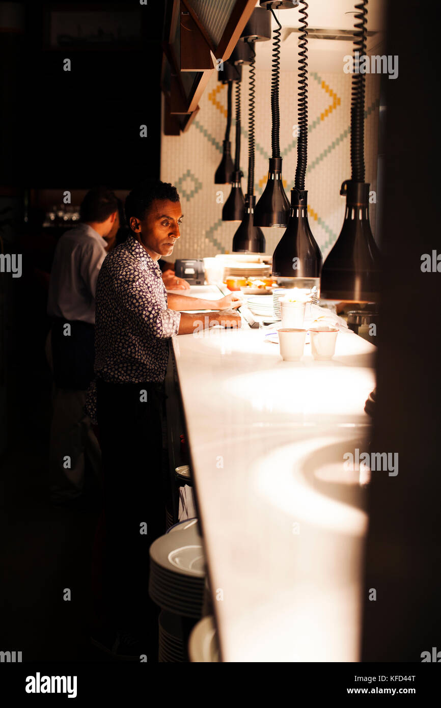 BERMUDA. Hamilton.Kitchen staff and crew during dinner service at ...