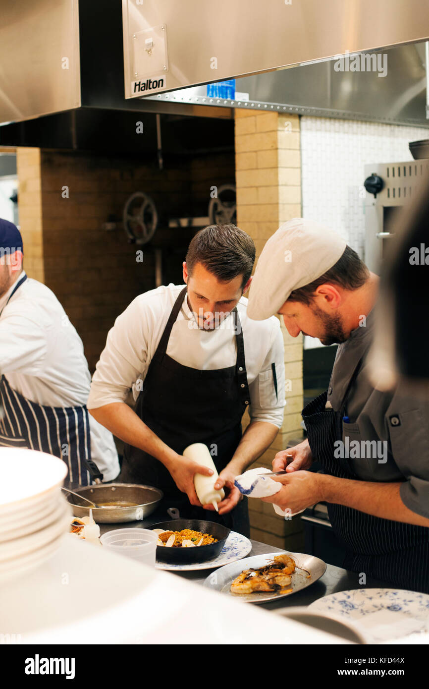 BERMUDA. Hamilton.Kitchen staff and crew during dinner service at ...