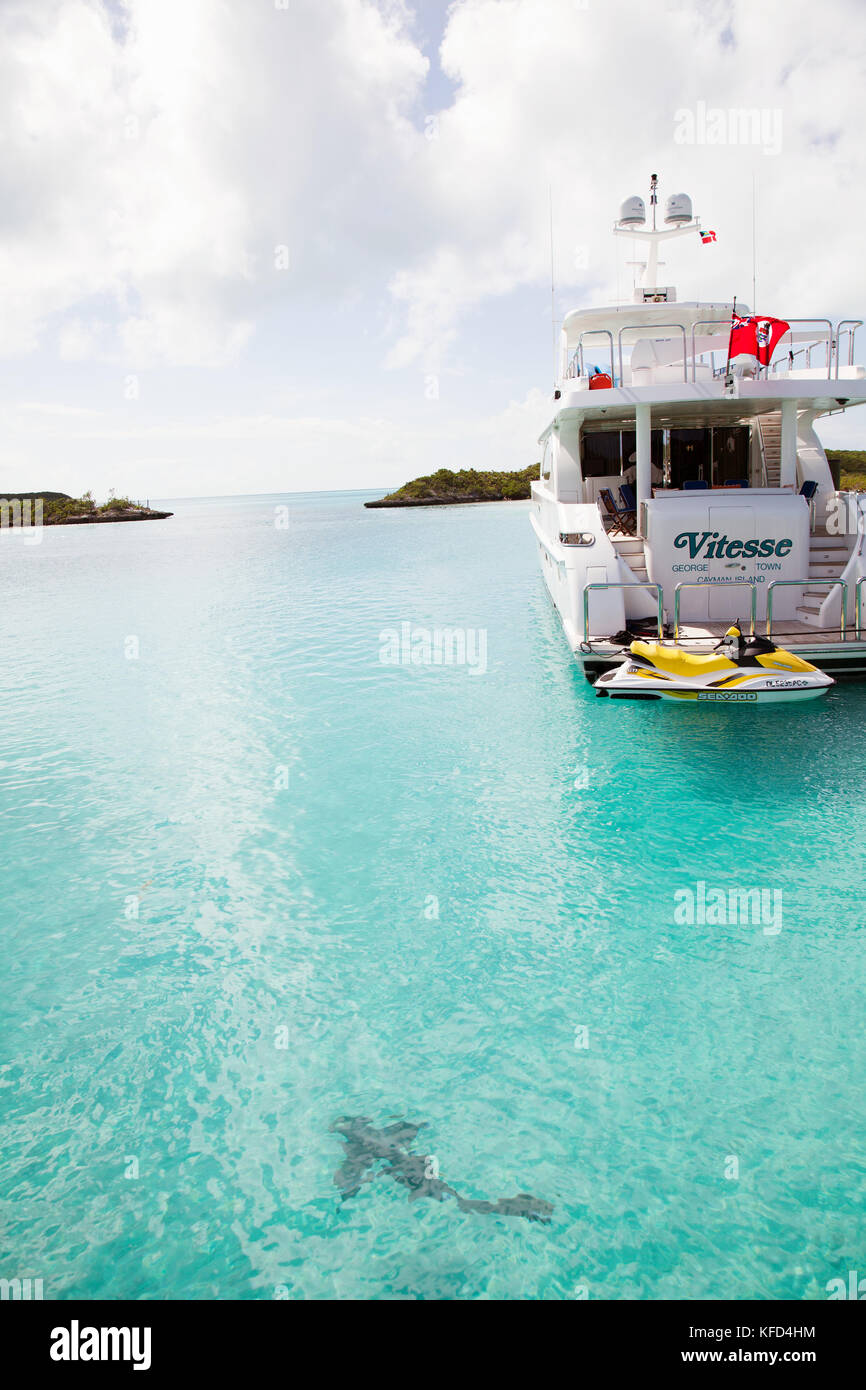 EXUMA, Bahamas. A nurse shark and a boat at the Compass Cay Marina ...