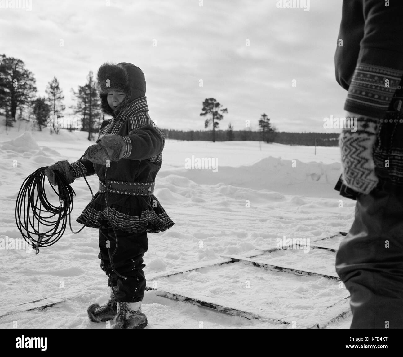 FINLAND, Hemet, Arctic, a Sami boy wearing the traditional Sami outfit ...