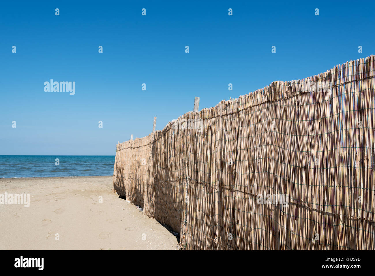 Fence on beach, Apulia, Italy Stock Photo - Alamy