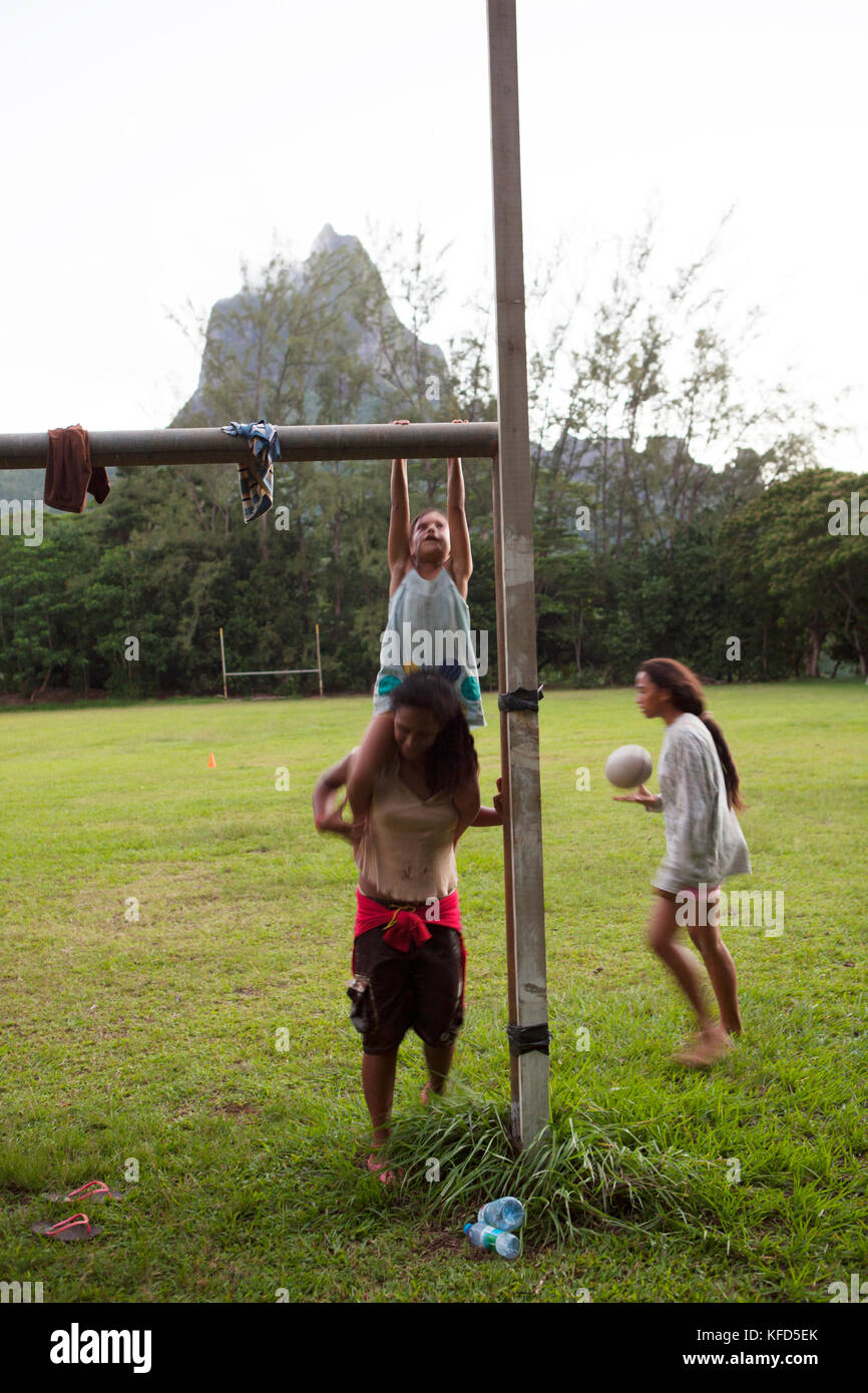 FRENCH POLYNESIA, Moorea. Girls playing at the Uop Honu Park in Moorea ...