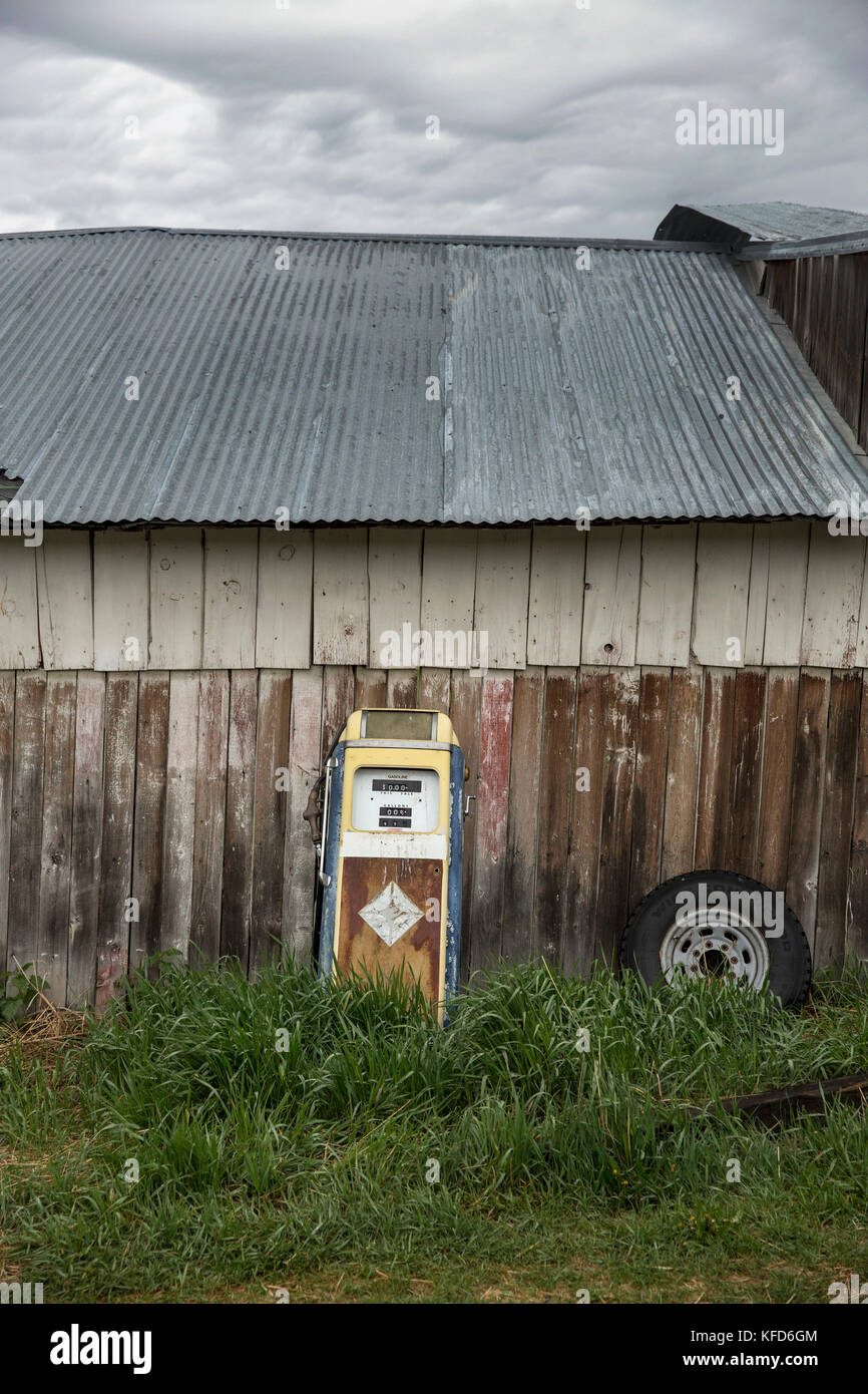 USA, Oregon, Enterprise, an old gas pump leans up against the side of a ...