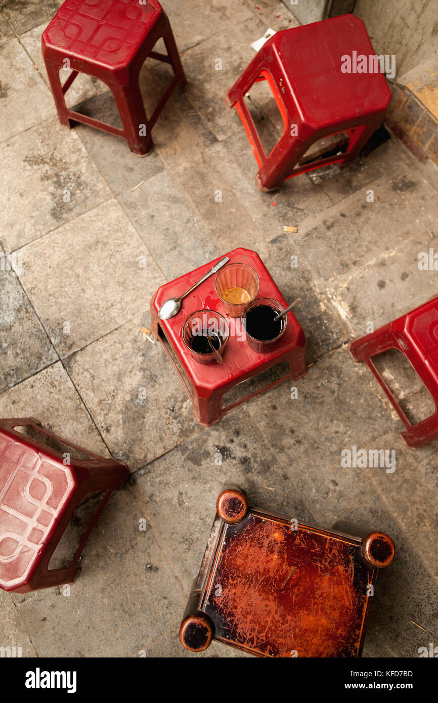 VIETNAM, Hanoi, small stools on the sidewalk in front of Cafe Nang ...