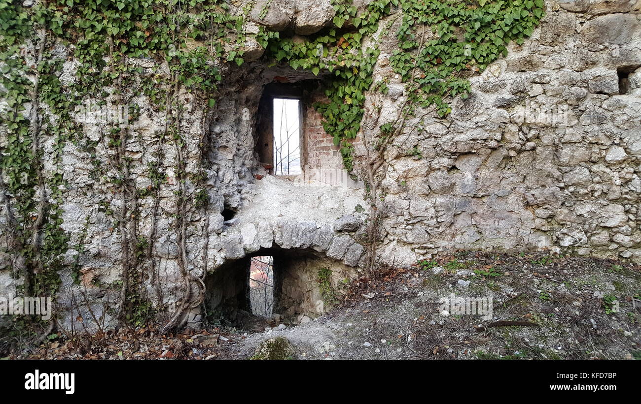 Massive stone castle wall openings for windows and lookout, partially ...