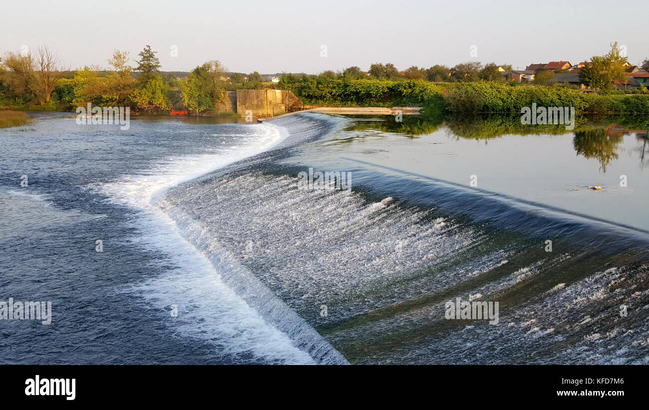 Calming river waterfall full of fresh drinking water with green ...