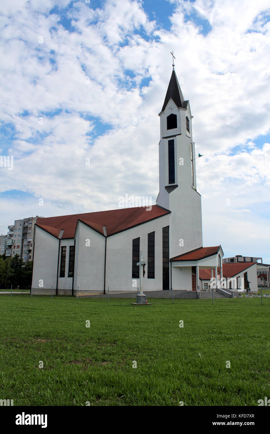 Modern built white church with and black roof located in front of ...