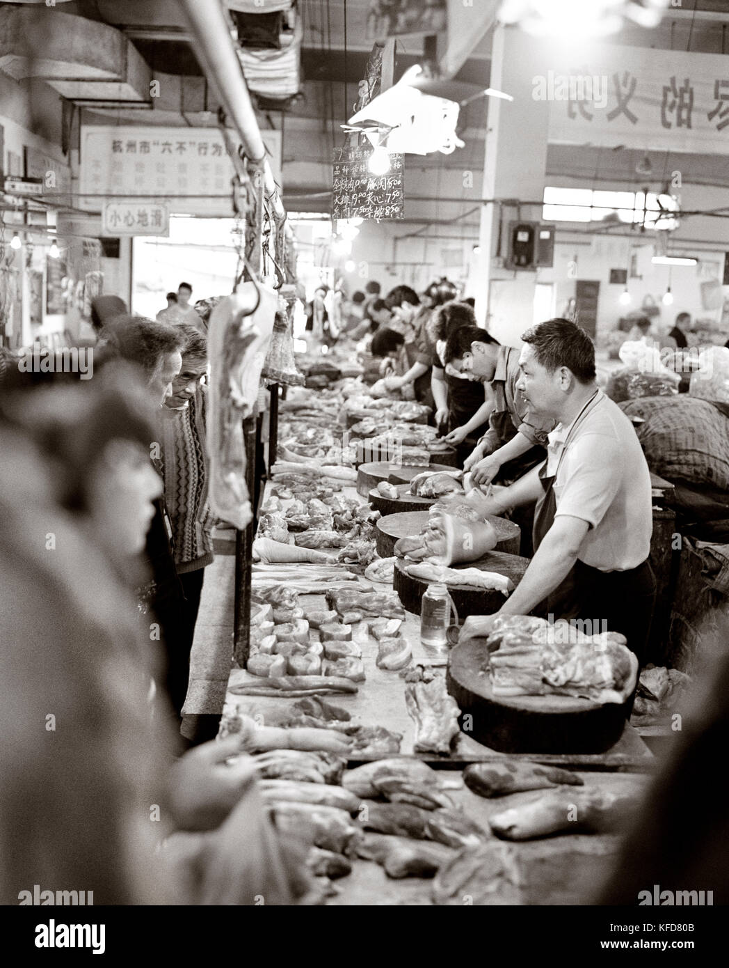 CHINA, Hangzhou, butchers sell meat at a market in Hangzhou (B&W Stock ...
