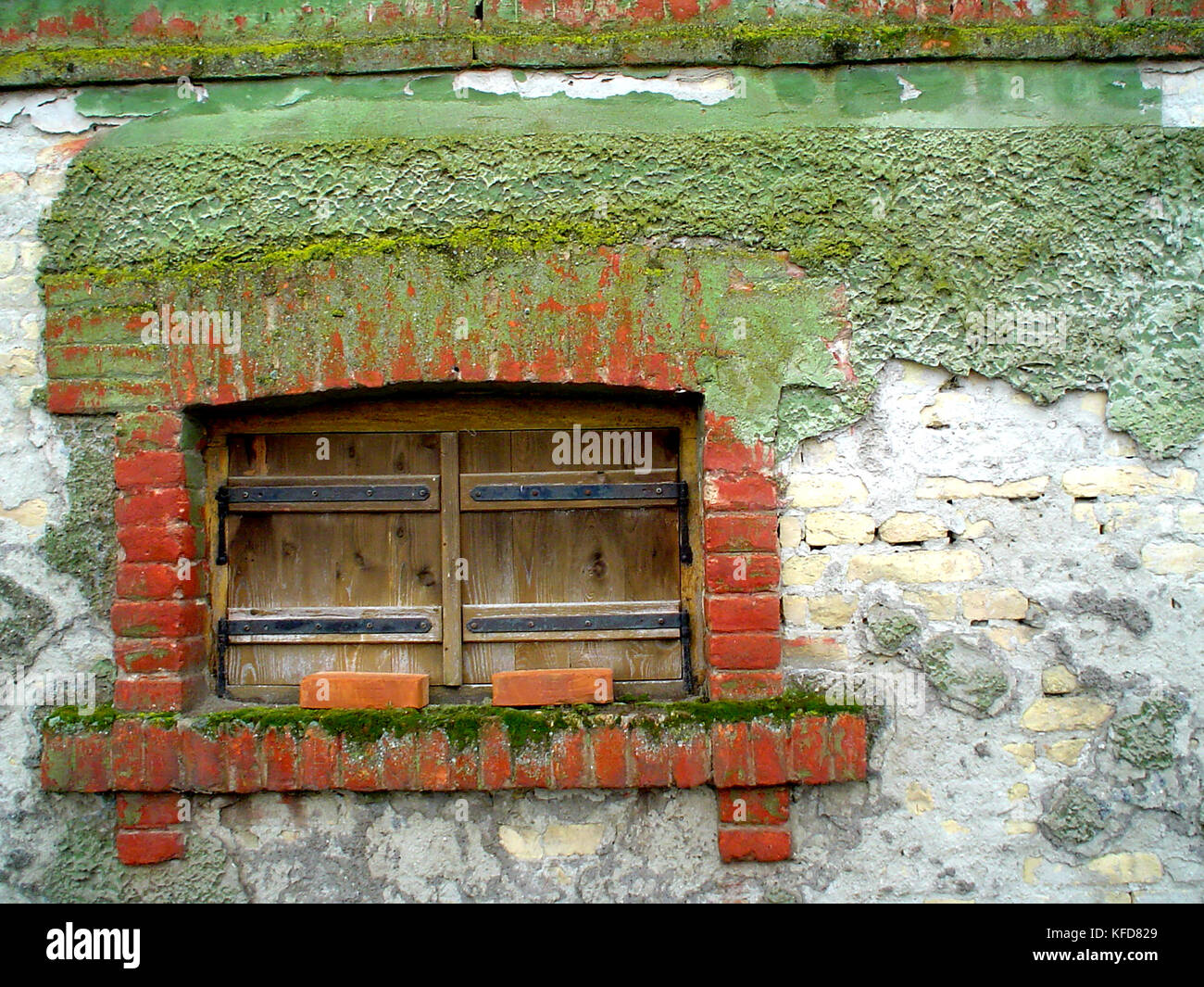 Wooden frame window with windows blinds built inside brick frame on ...