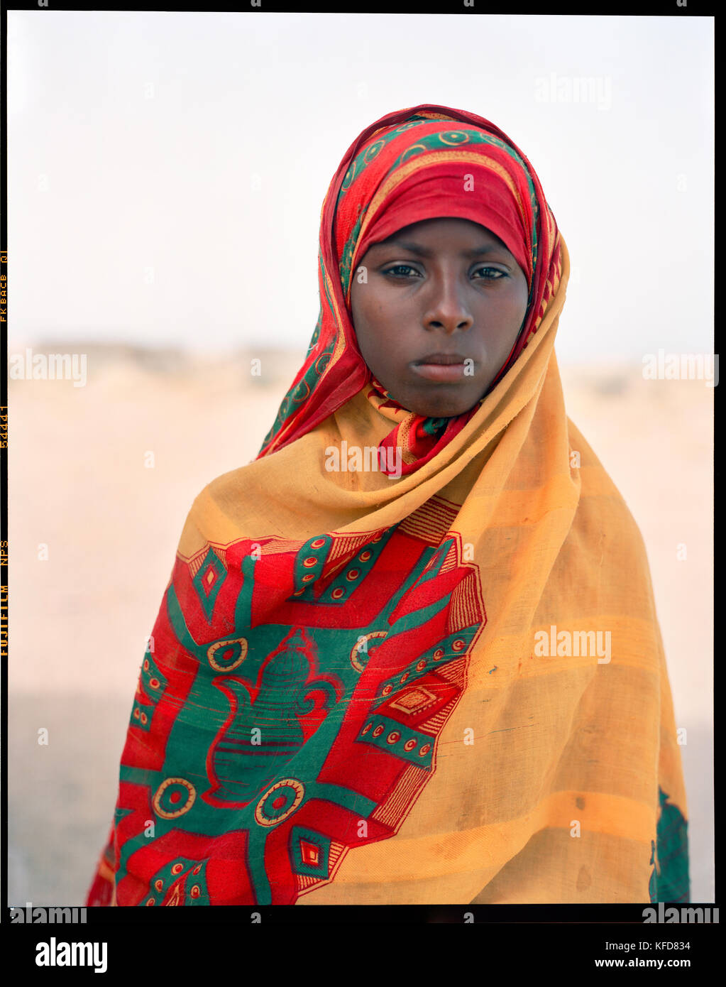 ERITREA, Village of Saroita, portrait of an Afar girl outside of her ...