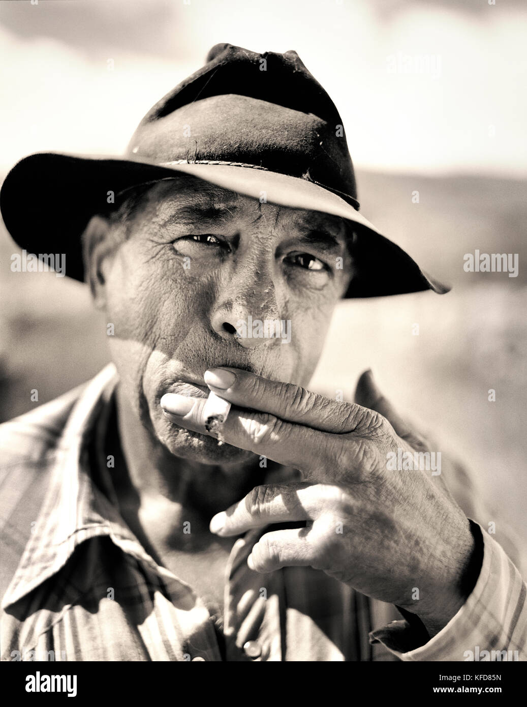 Cowboy smoking cigarette hi-res stock photography and images - Alamy