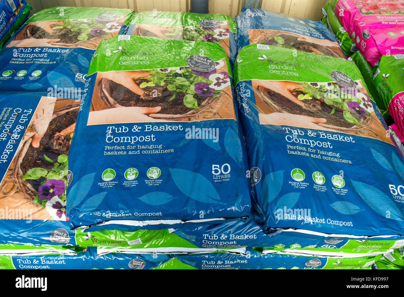 A stack of bags of Tub and Basket compost in a garden centre Stock ...