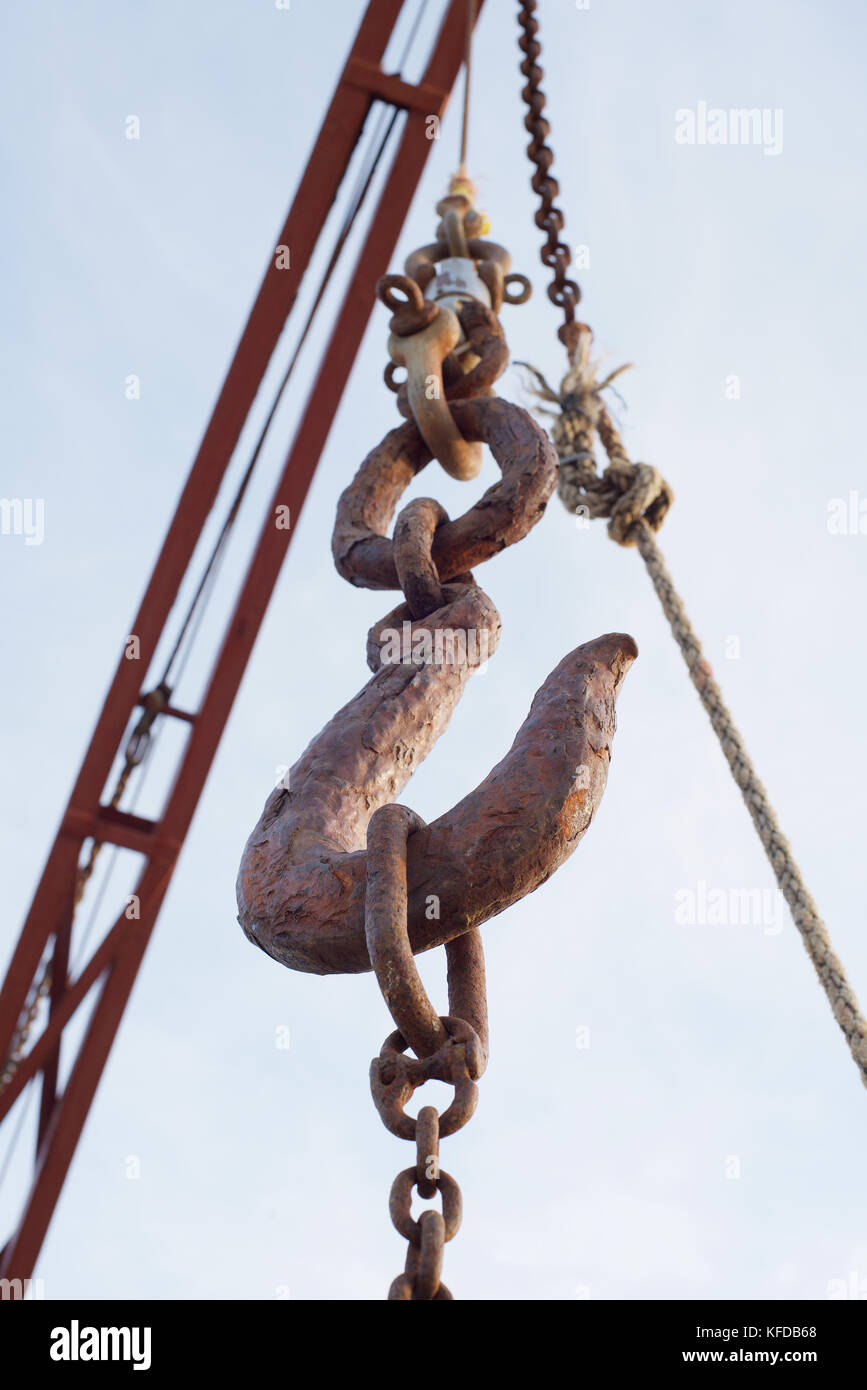 Detail of a hook and chain on a quayside Stock Photo - Alamy