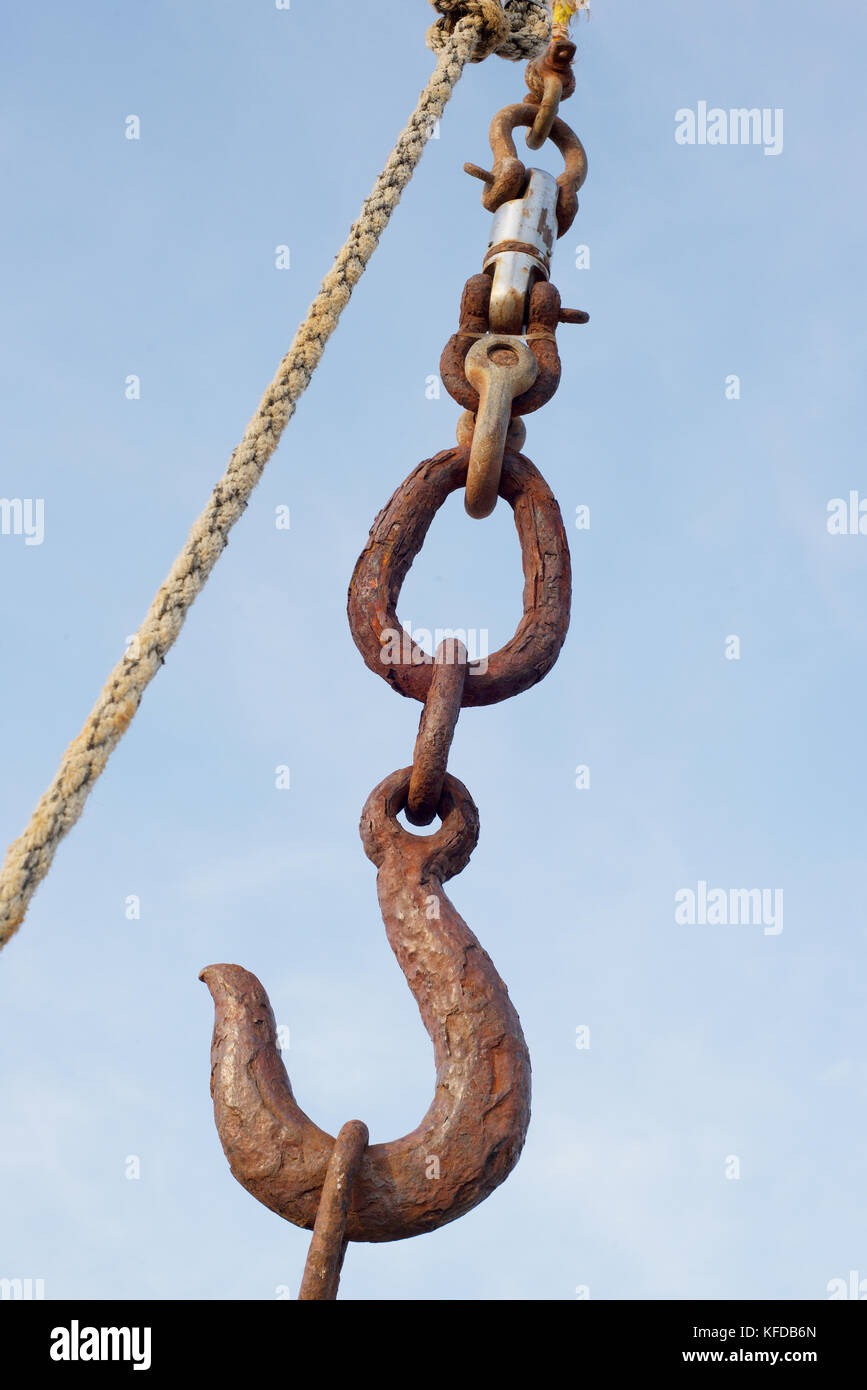 Detail of a hook and chain on a quayside Stock Photo - Alamy