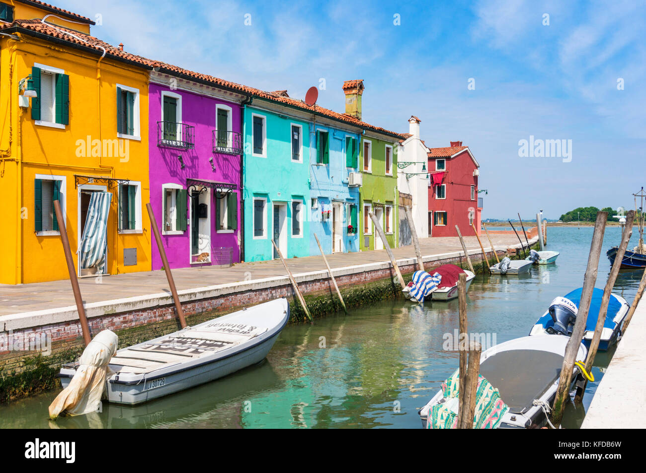 VENICE ITALY VENICE Colourful houses along a canal on the Island of ...