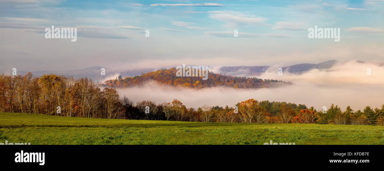 Floating mountain above low valley fog during Autumn in Landaff, NH ...