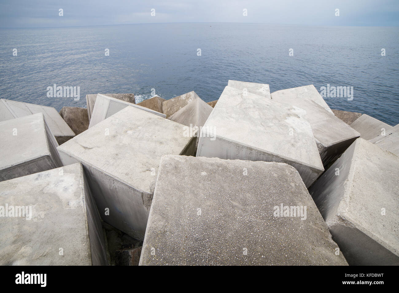 Plenty of heavy cubes lying in pile on shore of Asturias, Spain forming ...