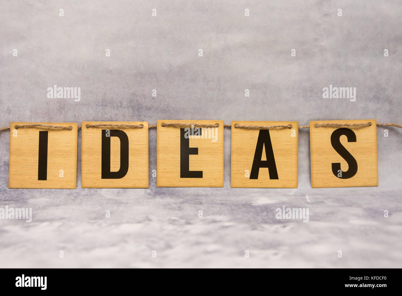 isolated tile letter of the alphabet on a patterned grey background ...