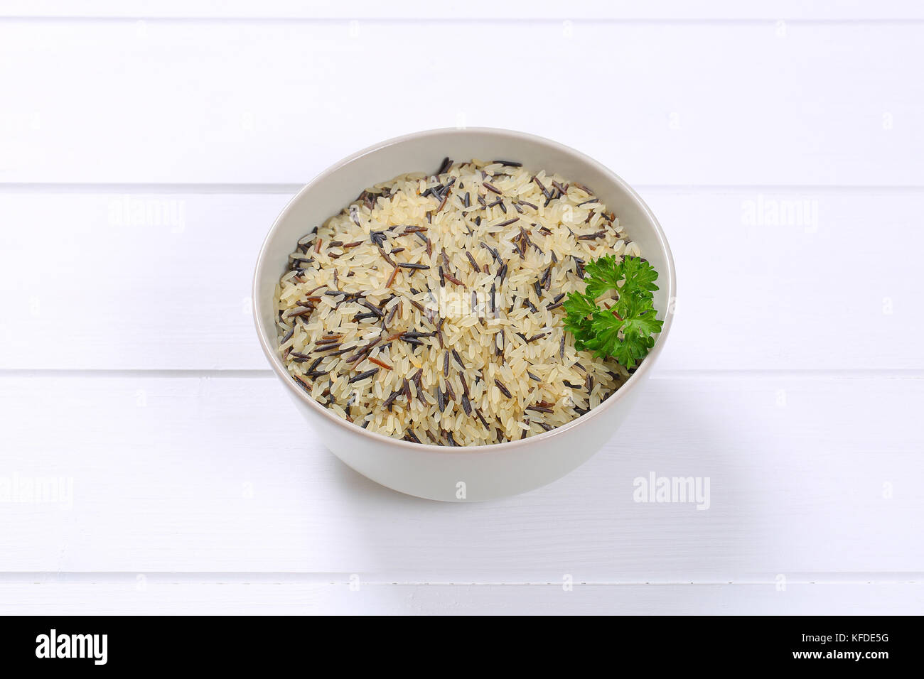 bowl of wild rice on white wooden background Stock Photo - Alamy