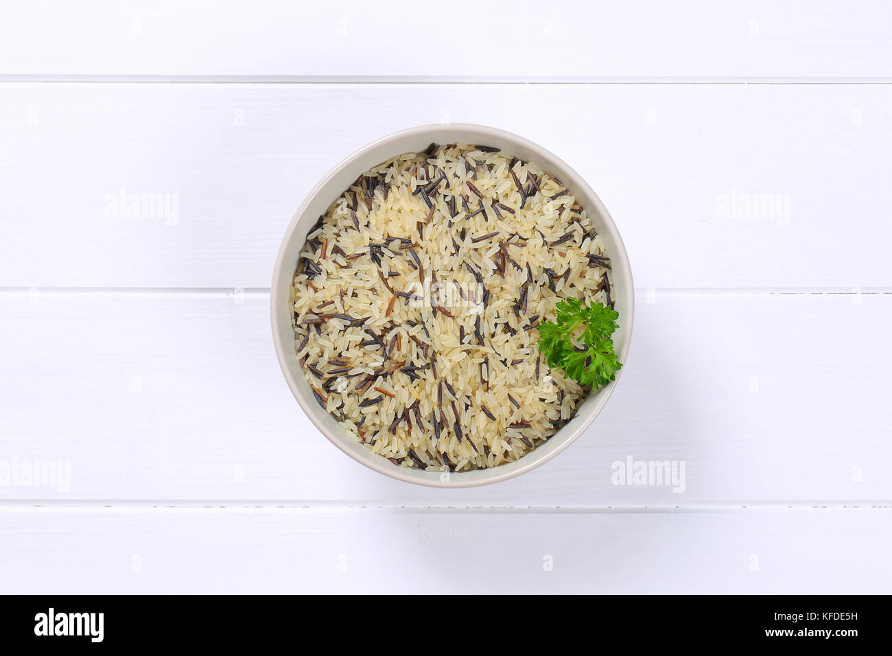 bowl of wild rice on white wooden background Stock Photo - Alamy