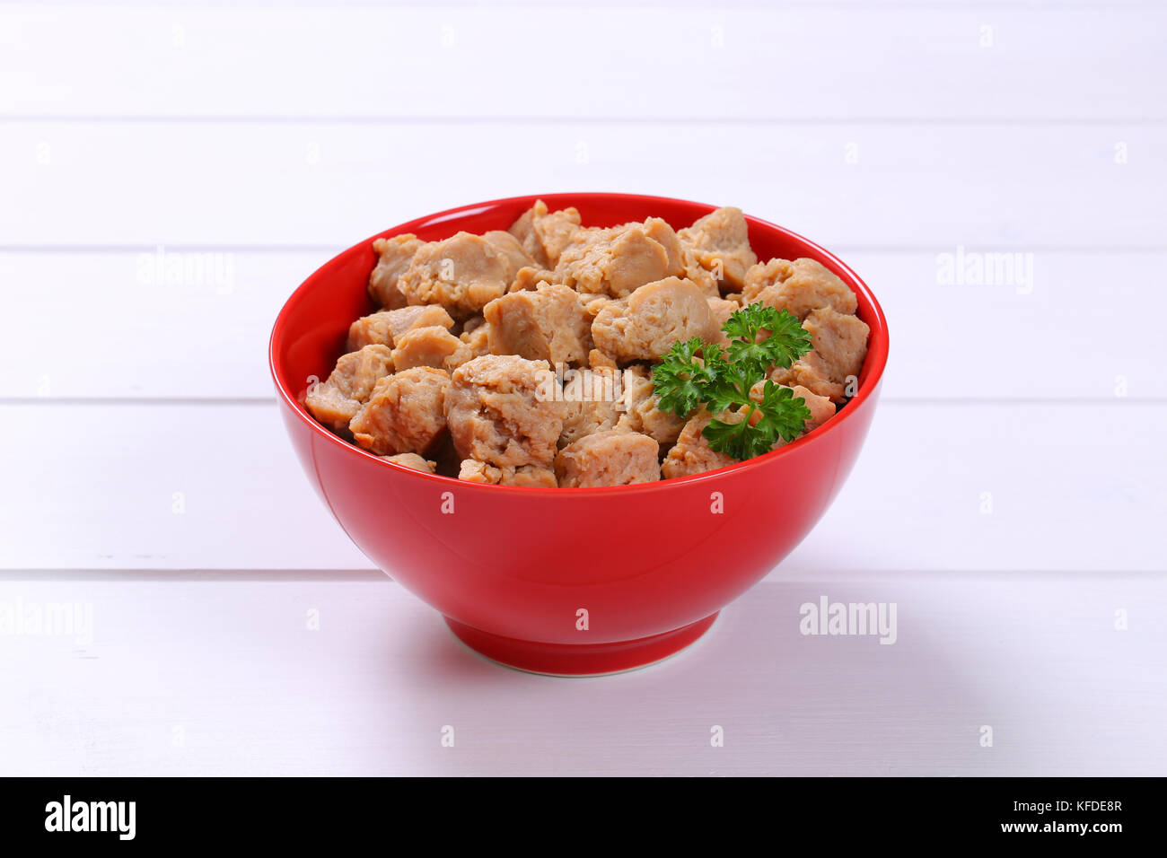 bowl of soy meat cubes on white wooden background Stock Photo - Alamy