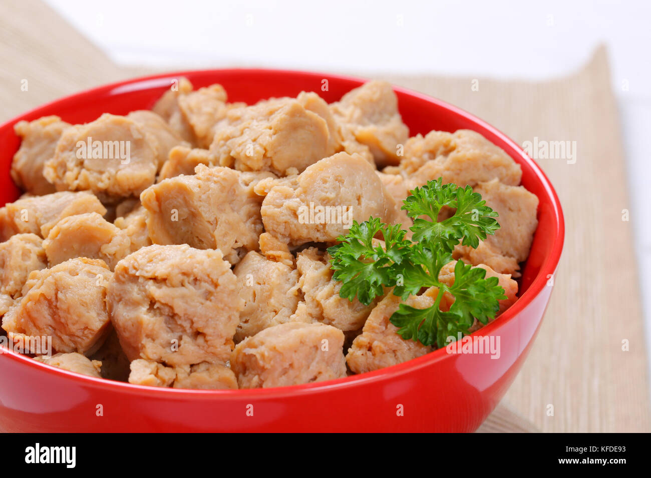 bowl of soy meat cubes on beige place mat - close up Stock Photo - Alamy