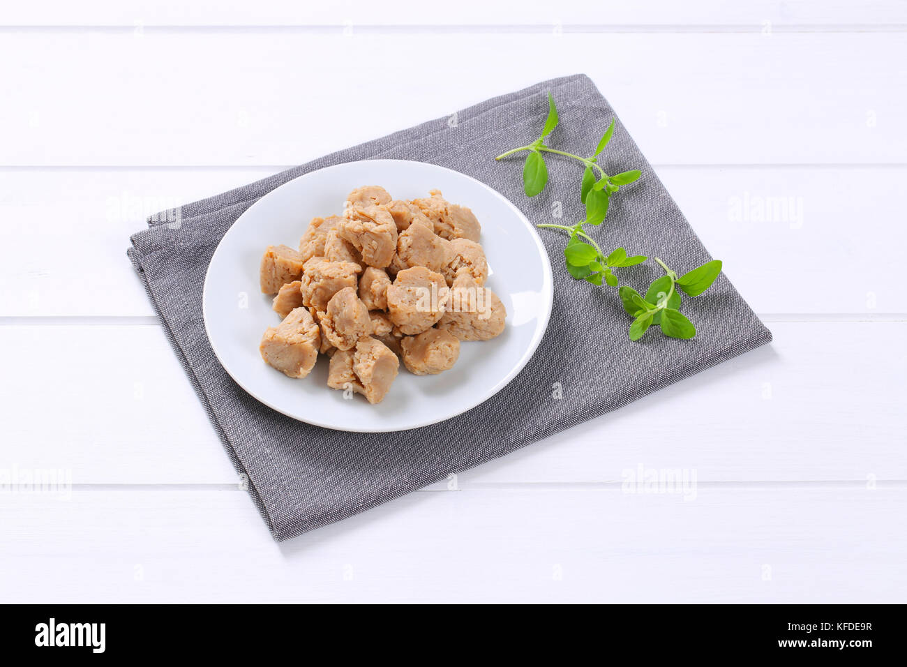 plate of soy meat cubes on grey place mat Stock Photo - Alamy