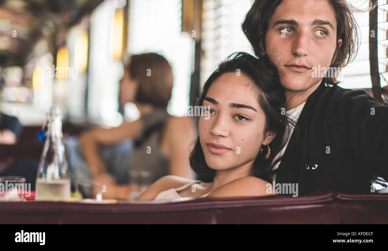Young man sitting in booth hi-res stock photography and images - Alamy