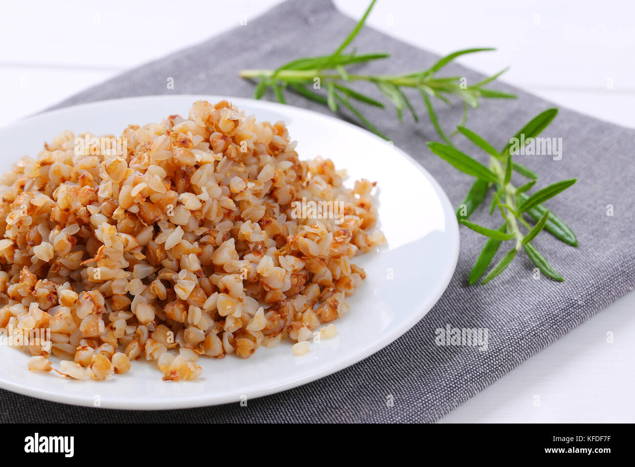 plate of cooked buckwheat on grey place mat - close up Stock Photo - Alamy