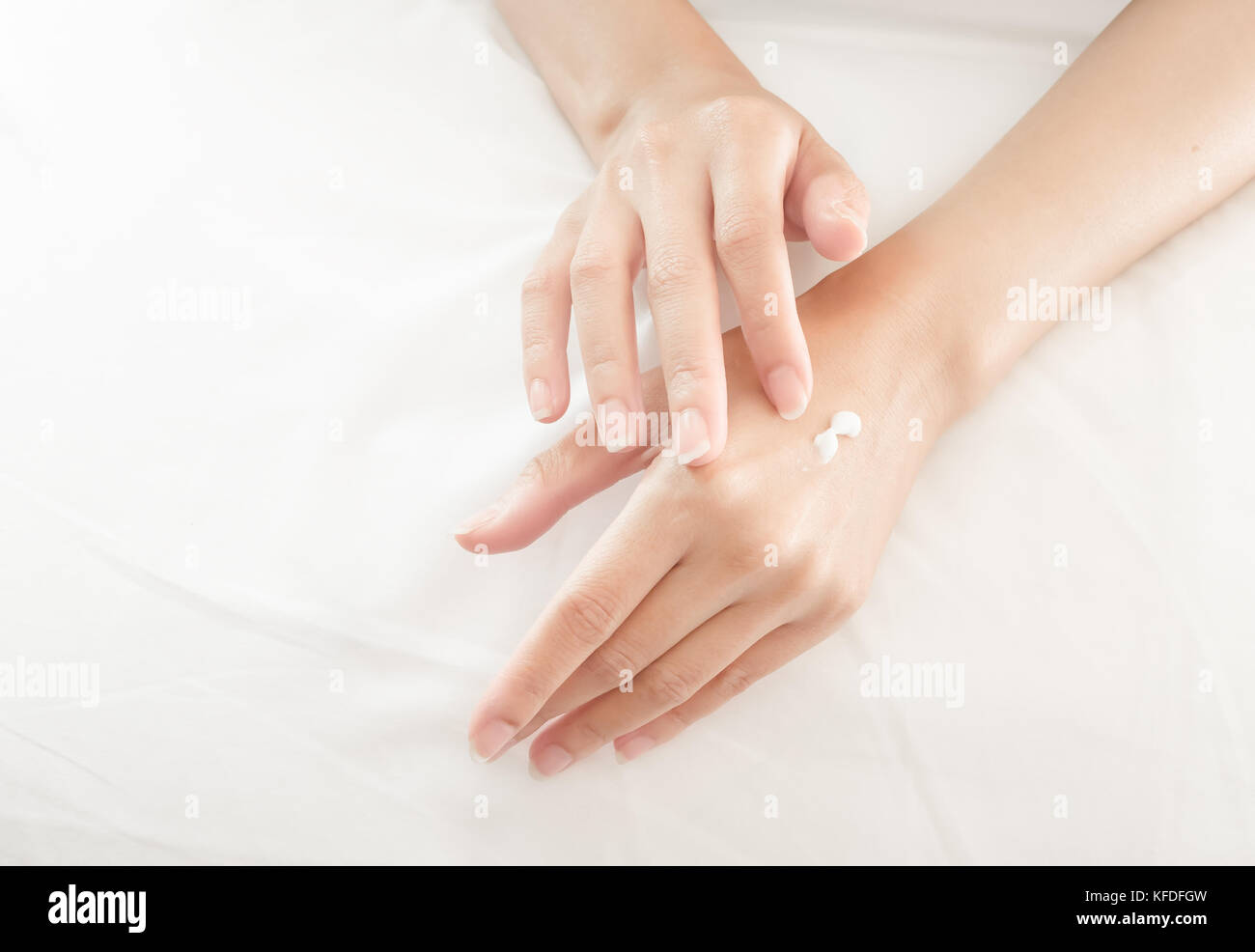 Beautiful woman hands with cream Stock Photo - Alamy