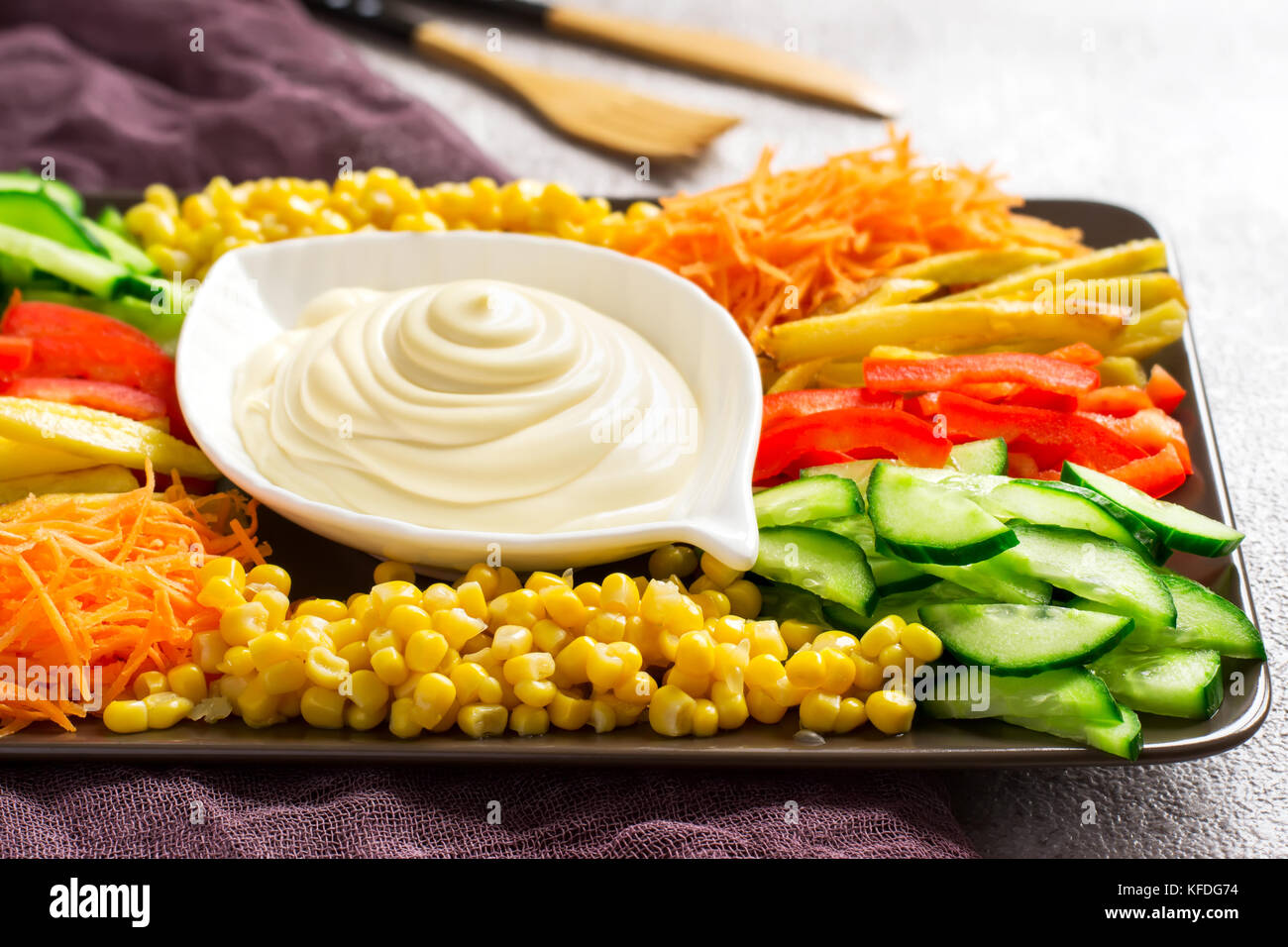 Homemade mayonnaise sauce. Dish with set of colorful vegetables ...