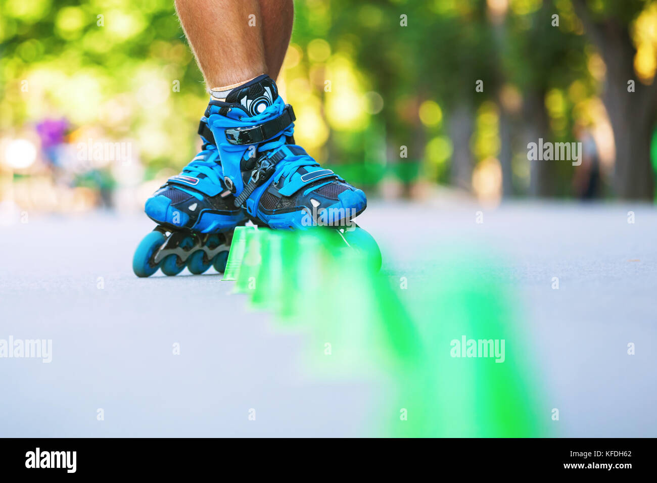 Close up of Inline roller skater on a slalom course Stock Photo - Alamy