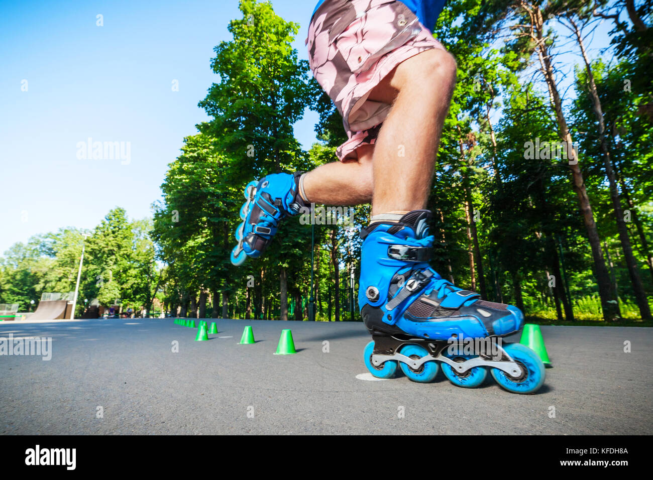 Close up of Inline roller skater on a slalom course Stock Photo - Alamy