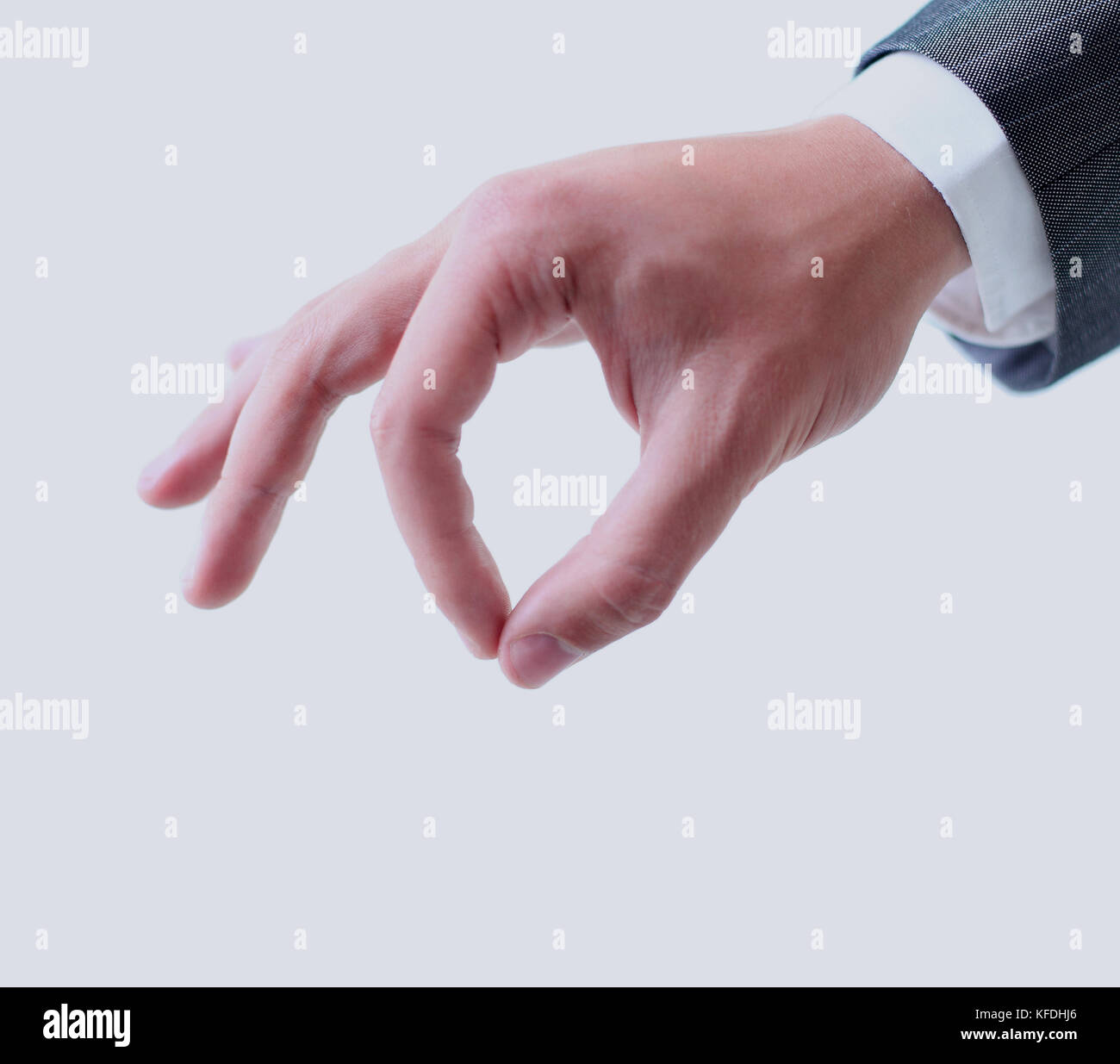 Business man hand making pinching gesture against a white background ...