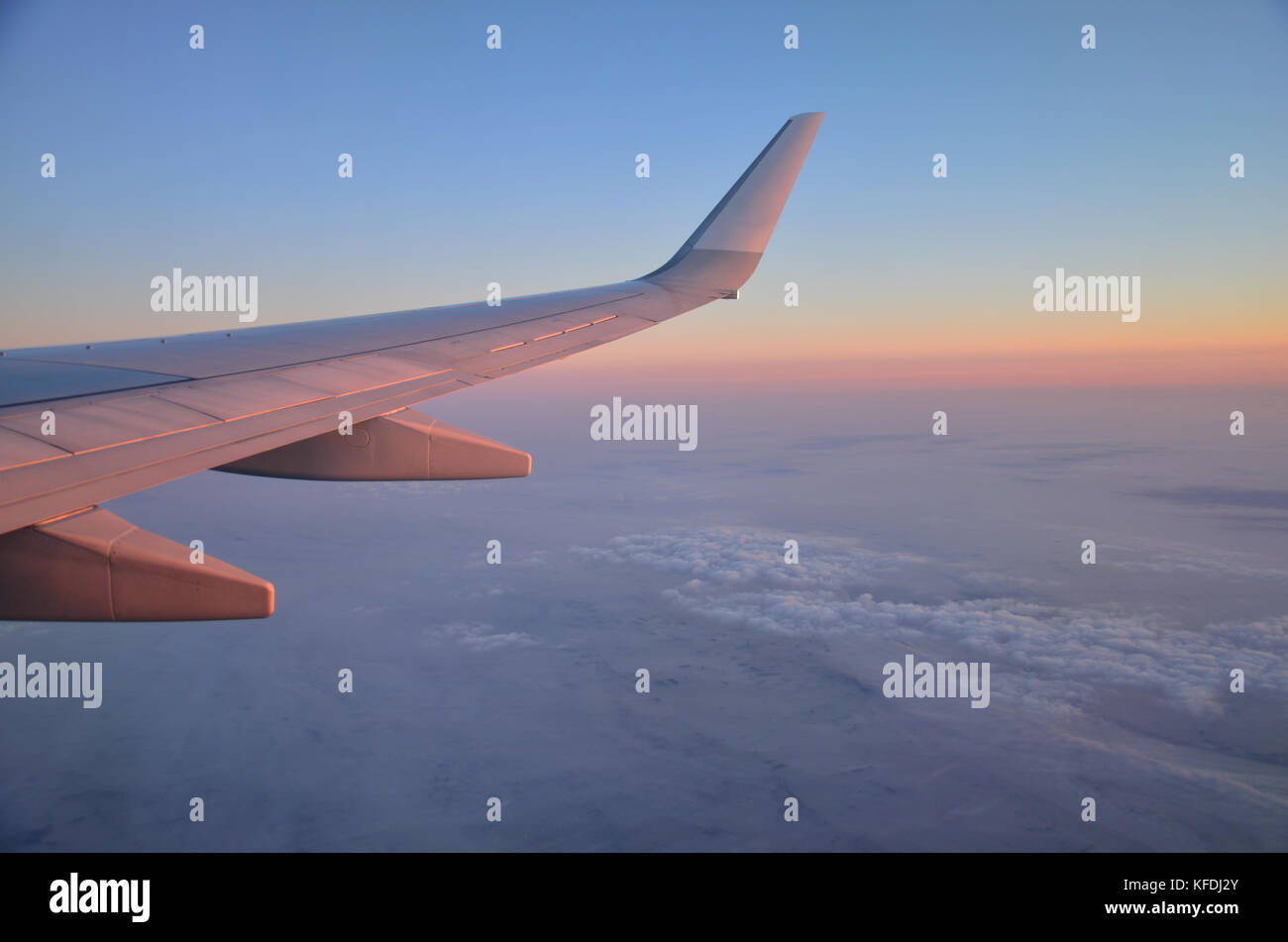 View of the sunset and wing from airplane window Stock Photo - Alamy