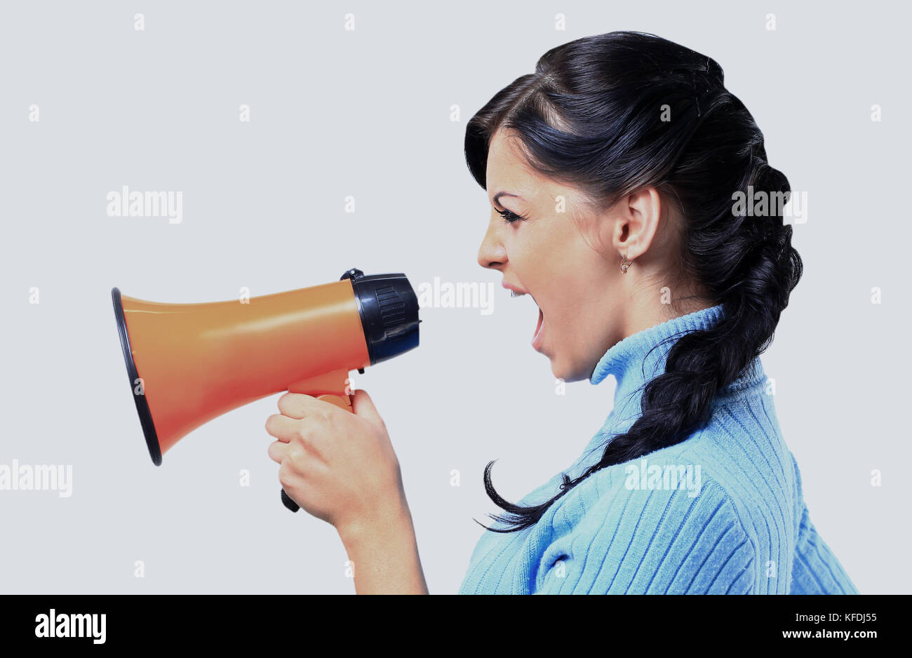 young woman speaking through megaphone Stock Photo - Alamy